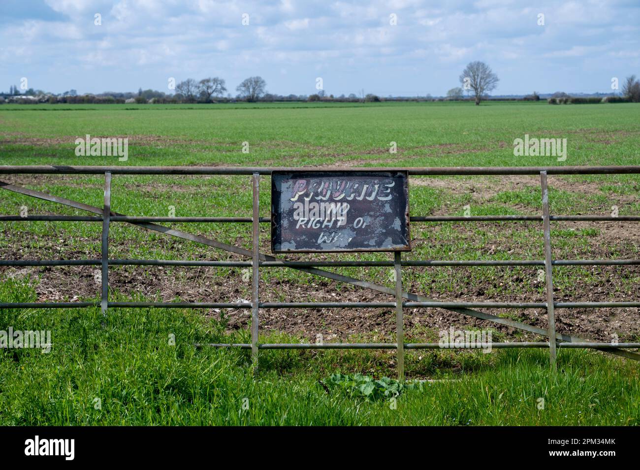 A locked gate and private no right of way sign at the entrance to a ...