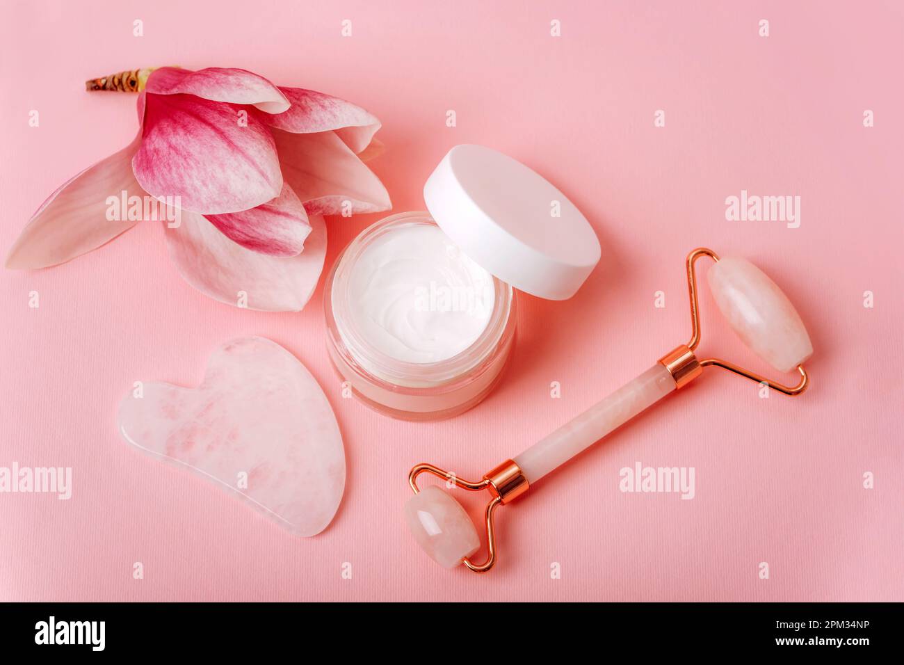 Rose quartz crystal facial roller and gua sha scraper, face cream ...