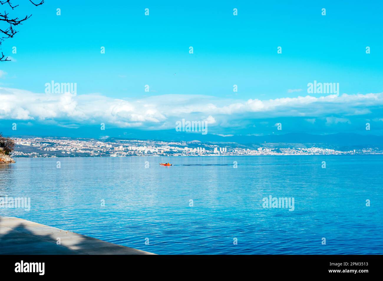 Beautiful blue sea with fishing boat. View of Rijeka city, Croatia ...