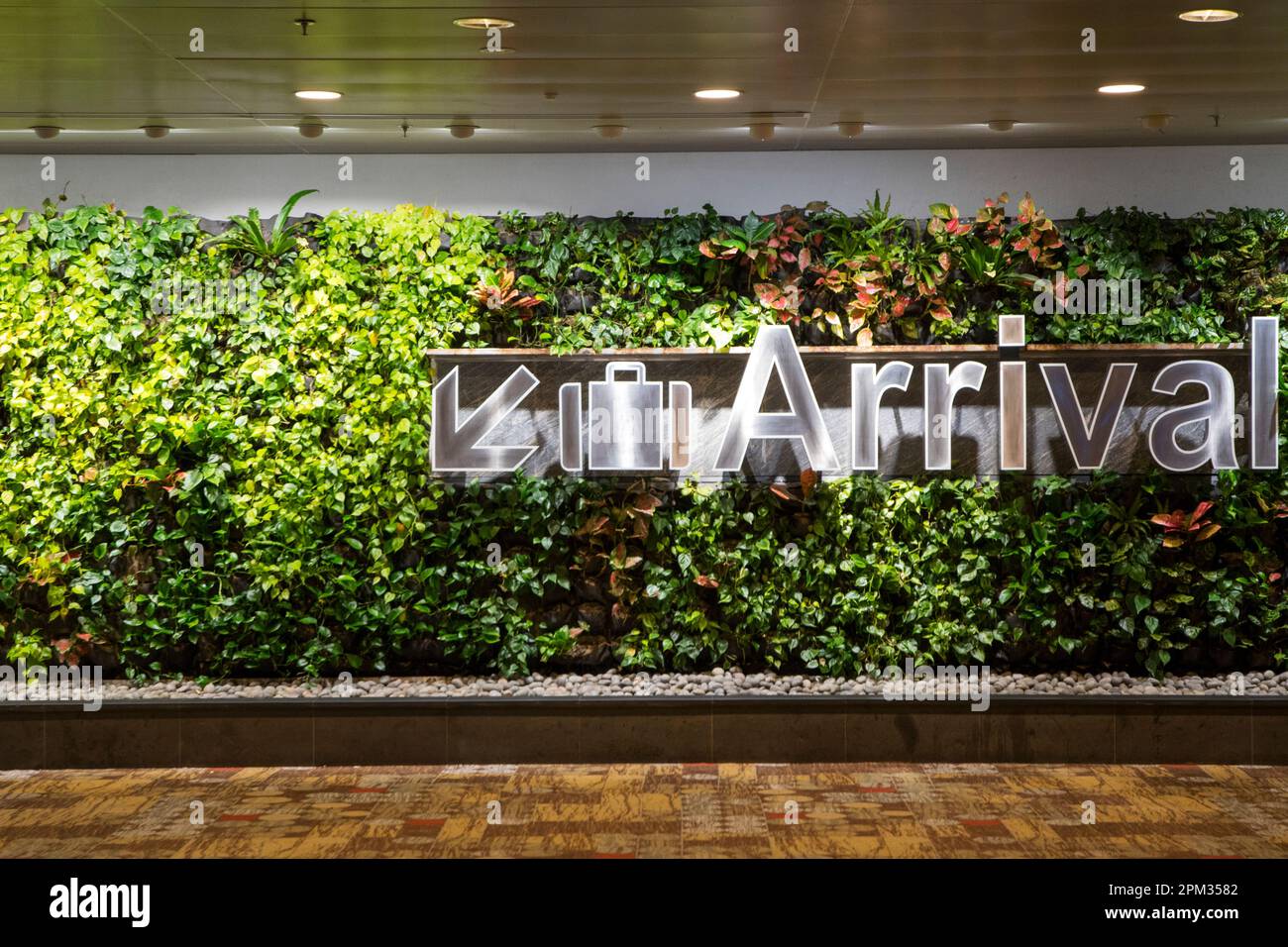 Arrival sign in Changi International Airport in Singapore. Changi is ...