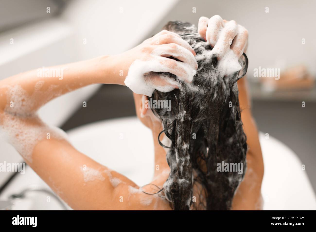 Female Applying Shampoo Washing Head Taking Bath Indoor, Back View ...