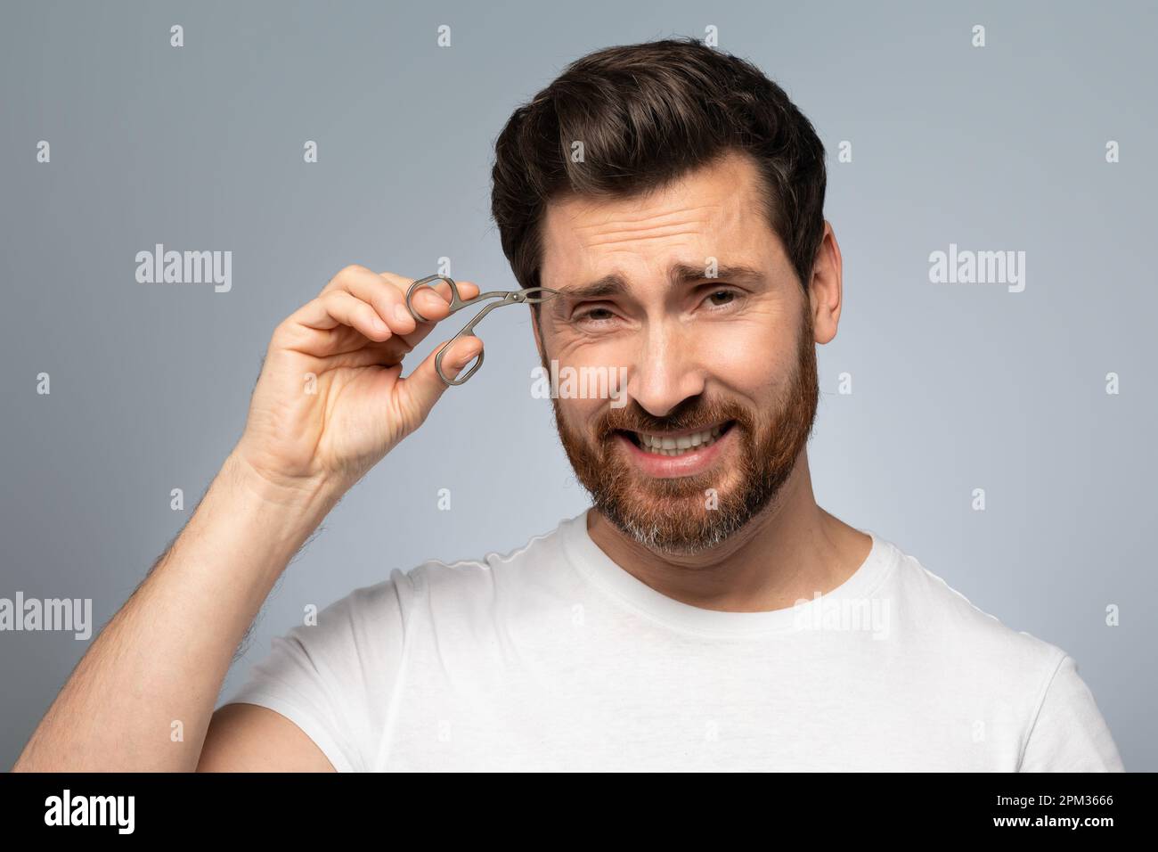 Hair removal and self care concept. Handsome bearded middle aged man ...