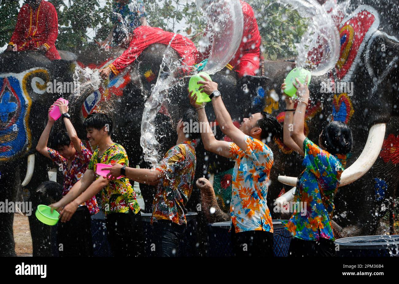 Ayutthaya, Thailand. 11th Apr, 2023. Elephants splash people with water in celebration of the ...