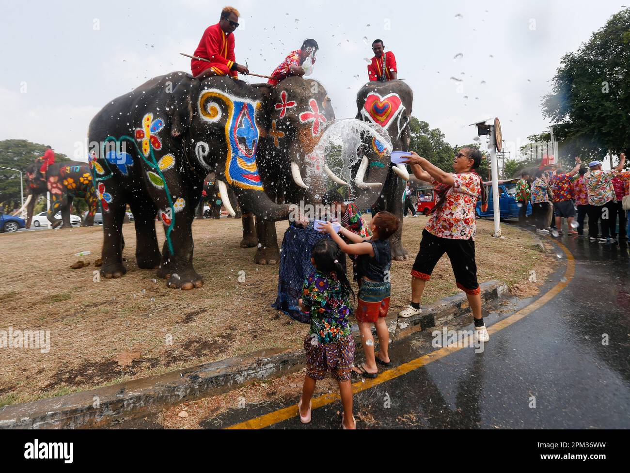 Ayutthaya, Thailand. 11th Apr, 2023. Elephants splash people with water in celebration of the ...
