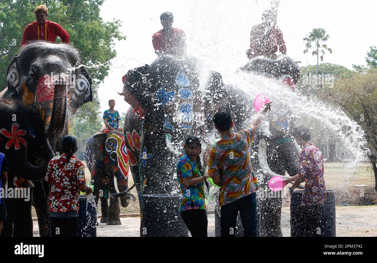 Ayutthaya, Thailand. 11th Apr, 2023. Elephants splash people with water in celebration of the ...