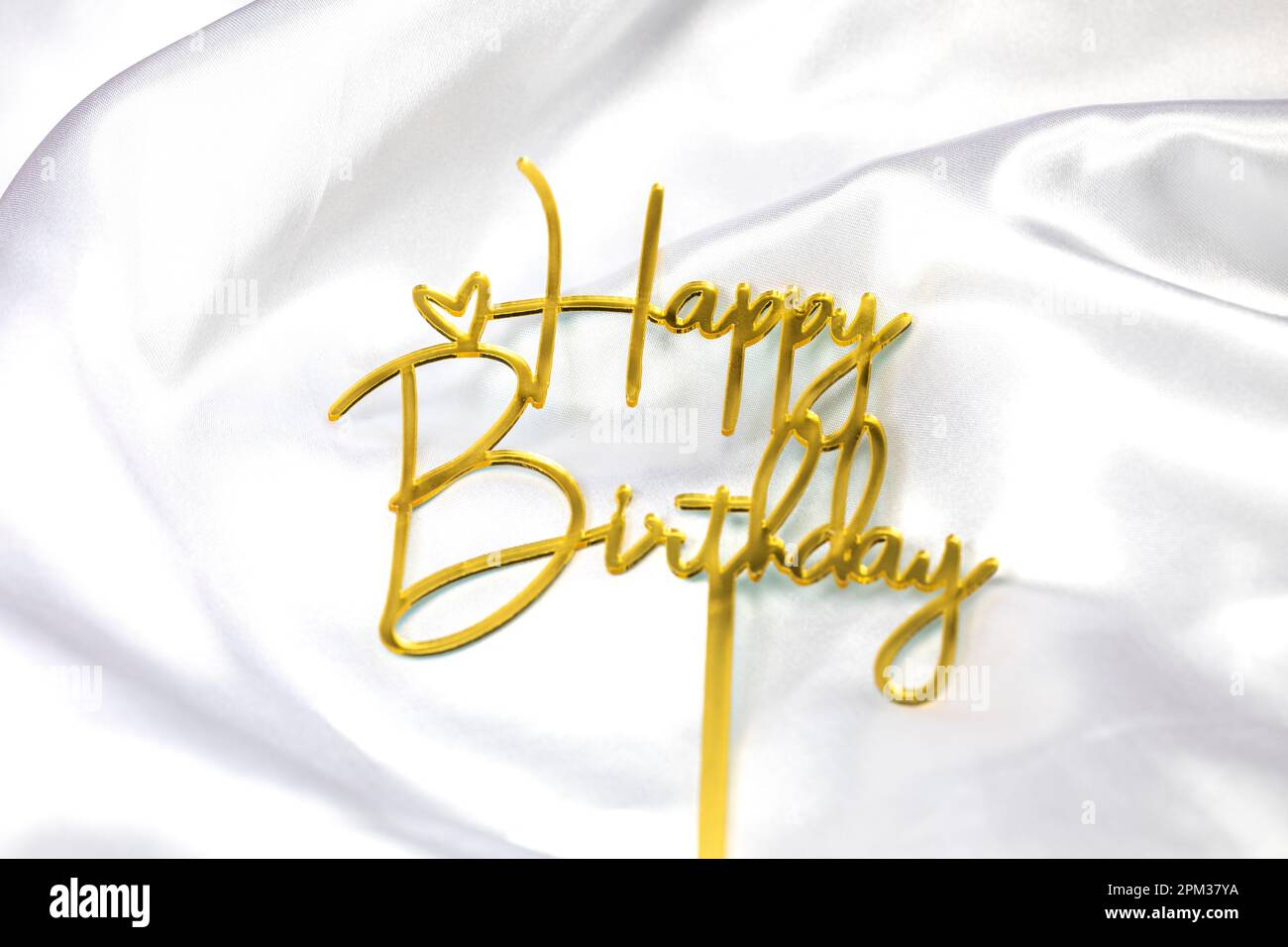 Happy Birthday text sign topper stick on white satin background ...