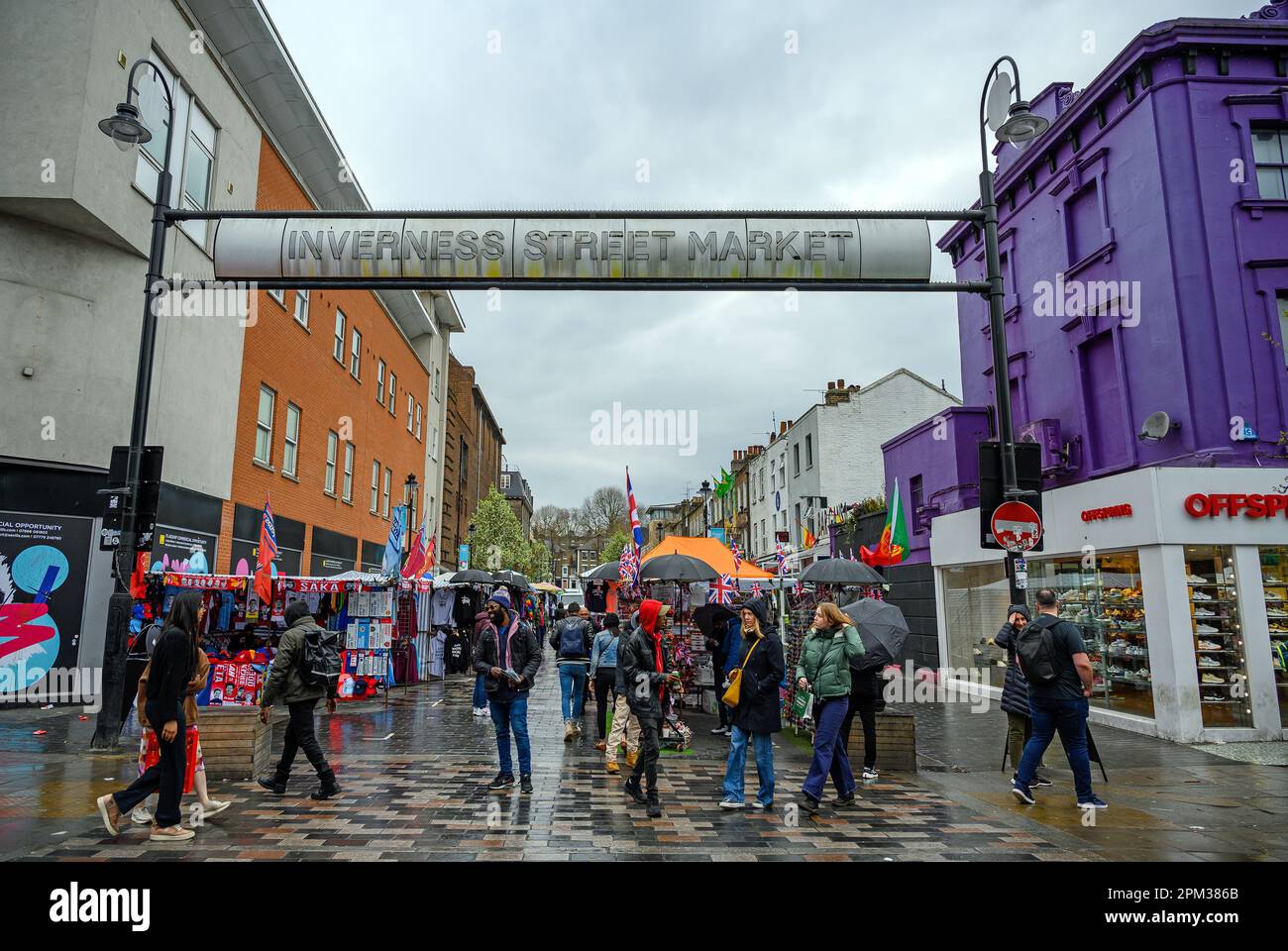 Camden Town, London, UK: People at the entrance to Inverness Street ...