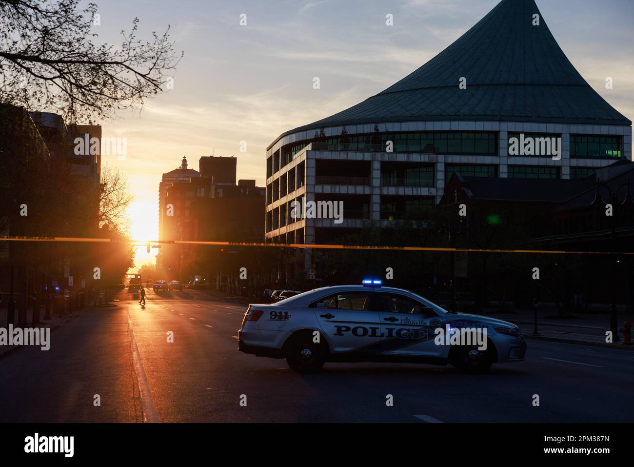 Police cars and cordon tape block Main Street near the Old National ...