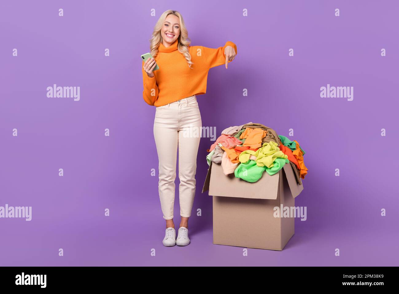 Full body portrait of charming lady hold smart phone direct finger pile ...