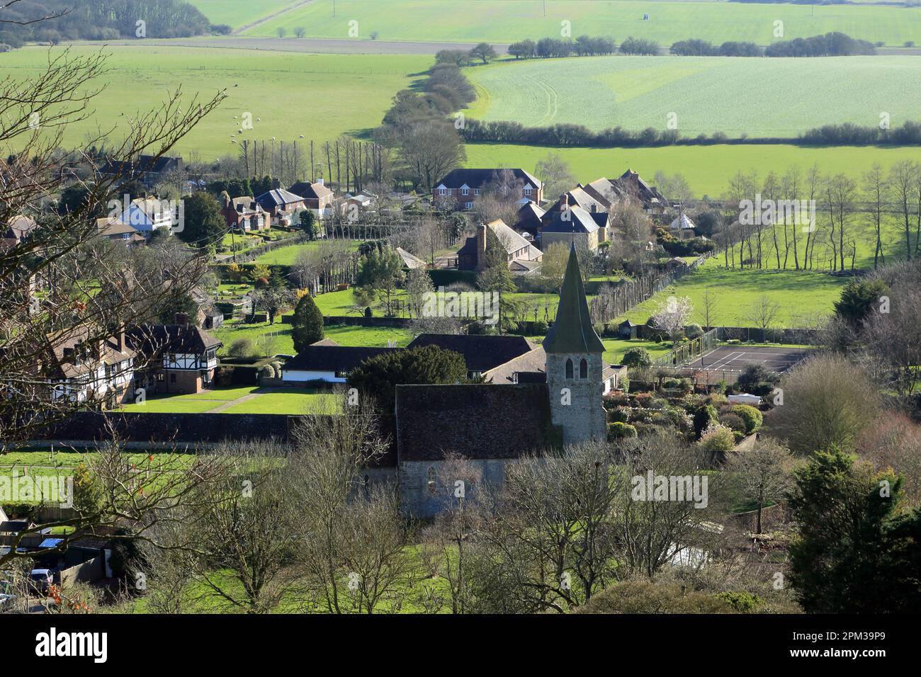 View of the rural village of Postling and church of Saint Mary and ...
