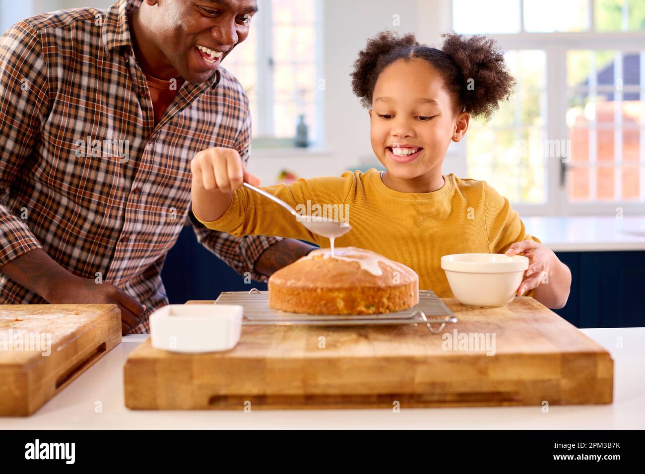 Family Shot With Father And Daughter Baking At Home In Kitchen ...