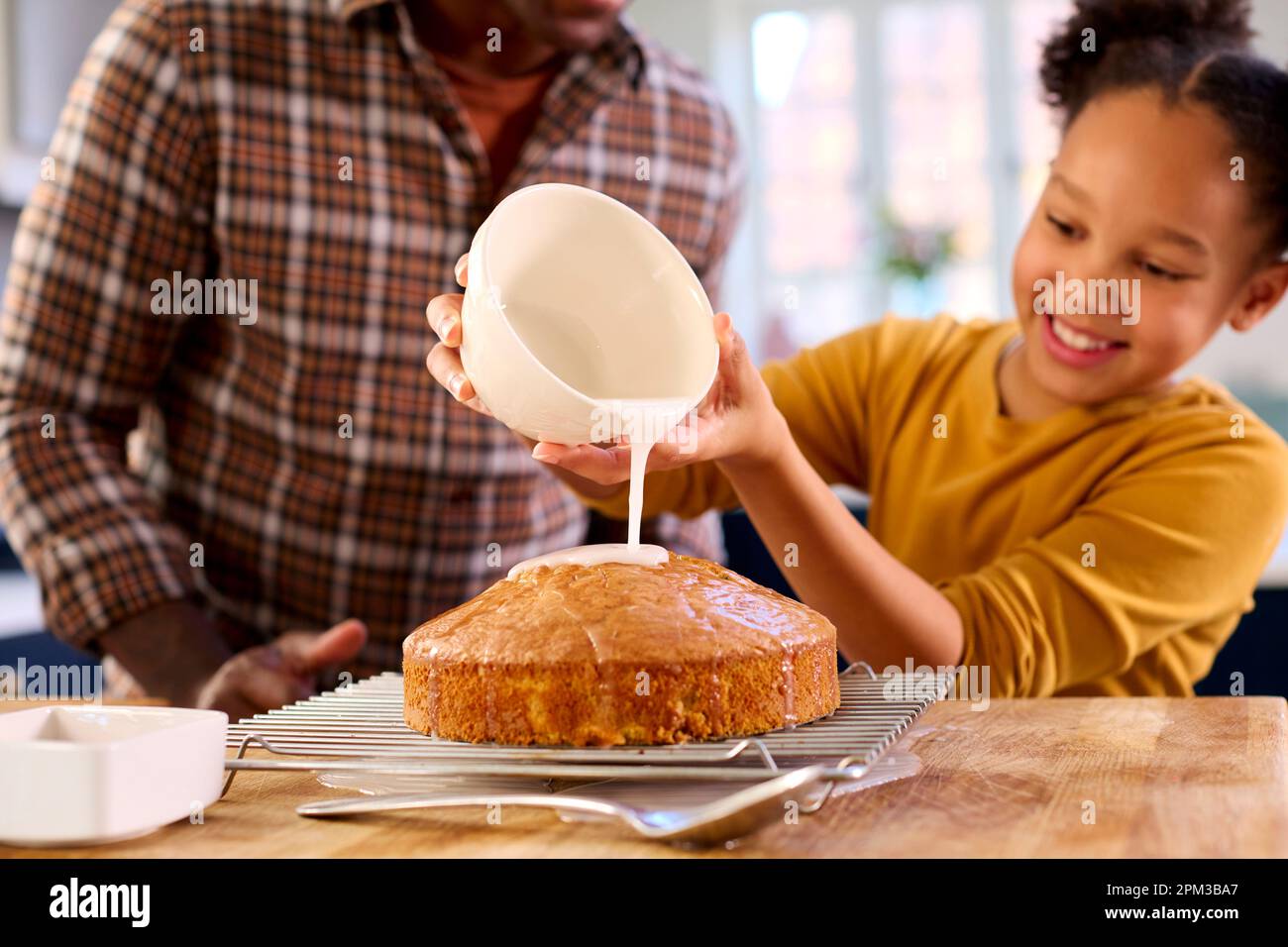 Family Shot With Father And Daughter Baking At Home In Kitchen ...
