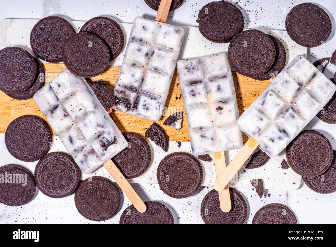 Cream and cookie popsicles ice cream, vanilla ice-cream lollipops with ...