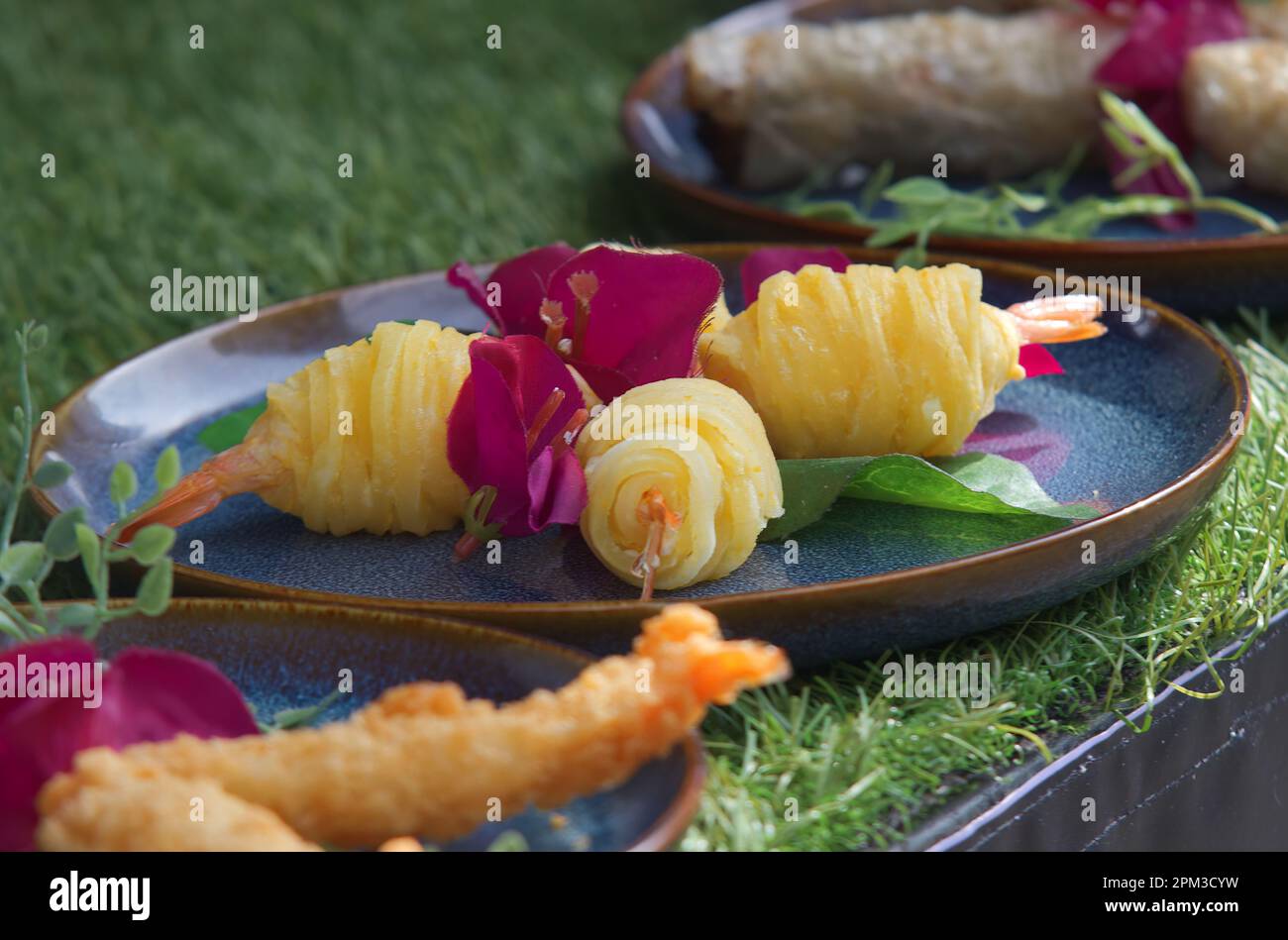 Deep fried shrimps, spring rolls and other fried stuff, closeup of ...