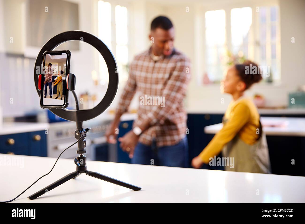 Father And Daughter At Home Recording Video Of Dance Routine For Social ...