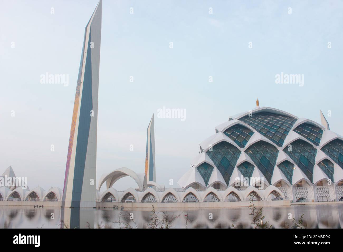 Landscape grand mosque of al jabbar with slightly cloudy skies in the ...