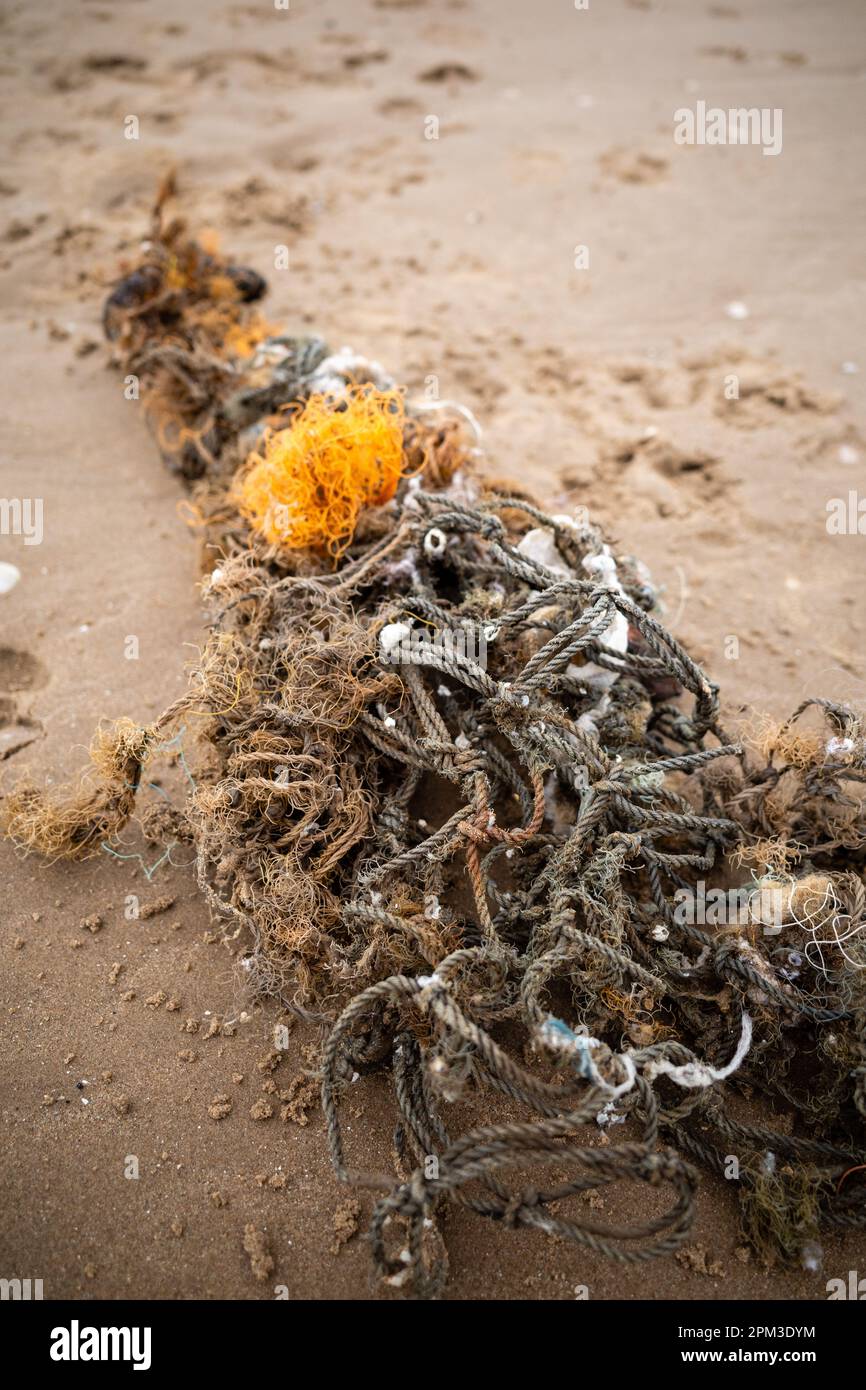 Torn fishing nets hi-res stock photography and images - Alamy