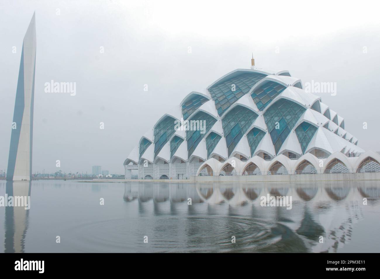 Landscape grand mosque of al jabbar with slightly cloudy skies in the ...
