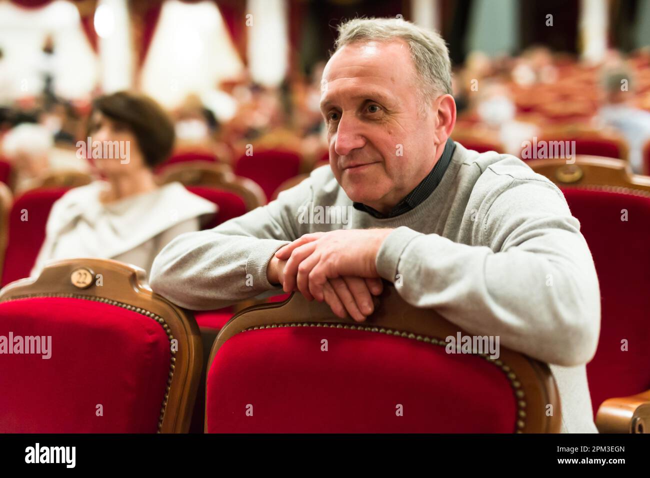 elderly couple watching play in the theater Stock Photo - Alamy