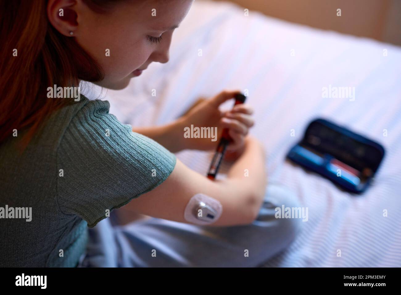 Close Up Of Diabetic Girl On Bed In At Home Using Insulin Pen To ...