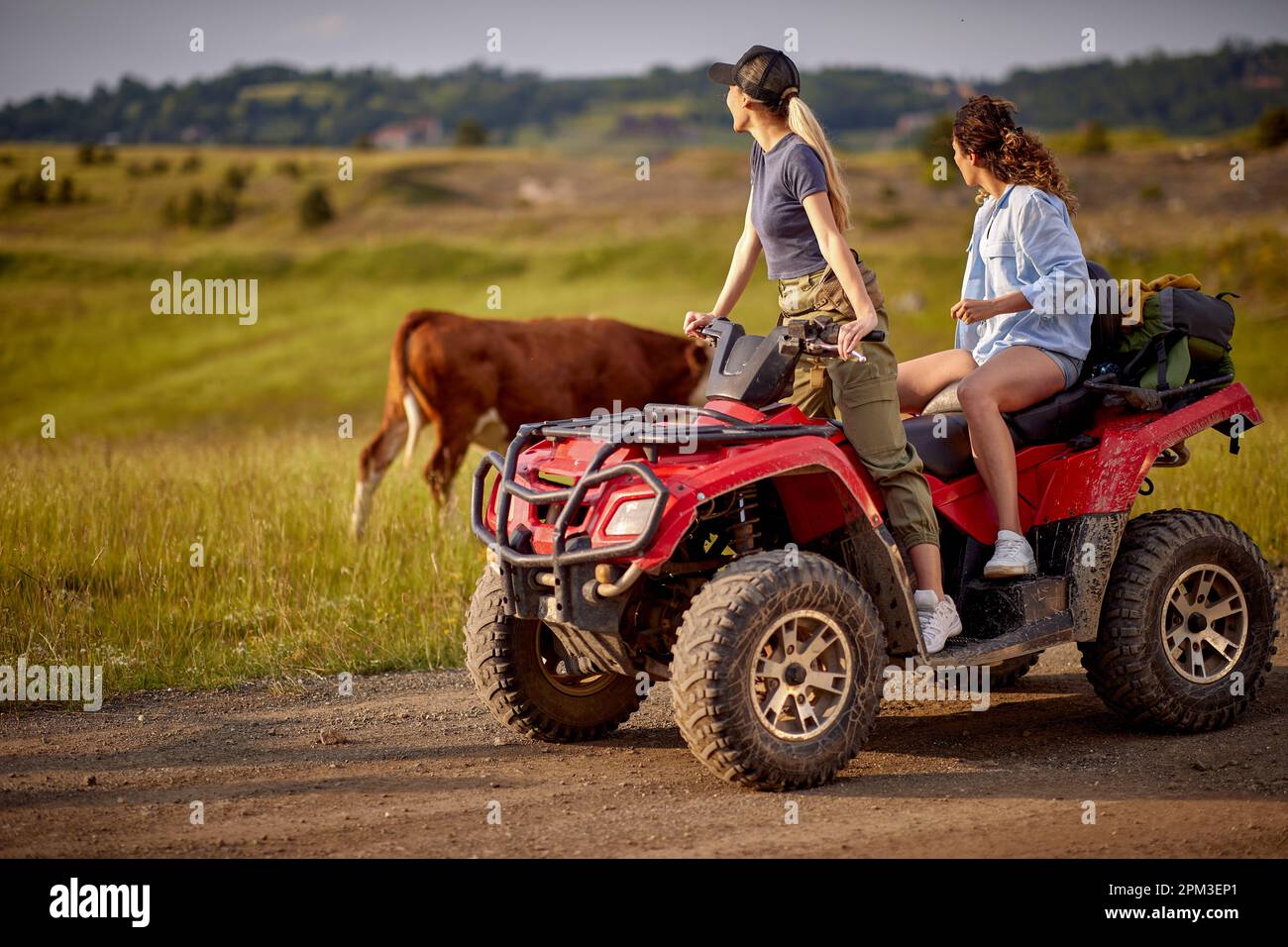 ATV Quad Bike of mountains.Girl have fun at journey together Stock ...