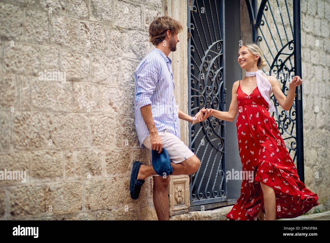 Romantic caucasian couple on a walk trough an old town together Stock ...