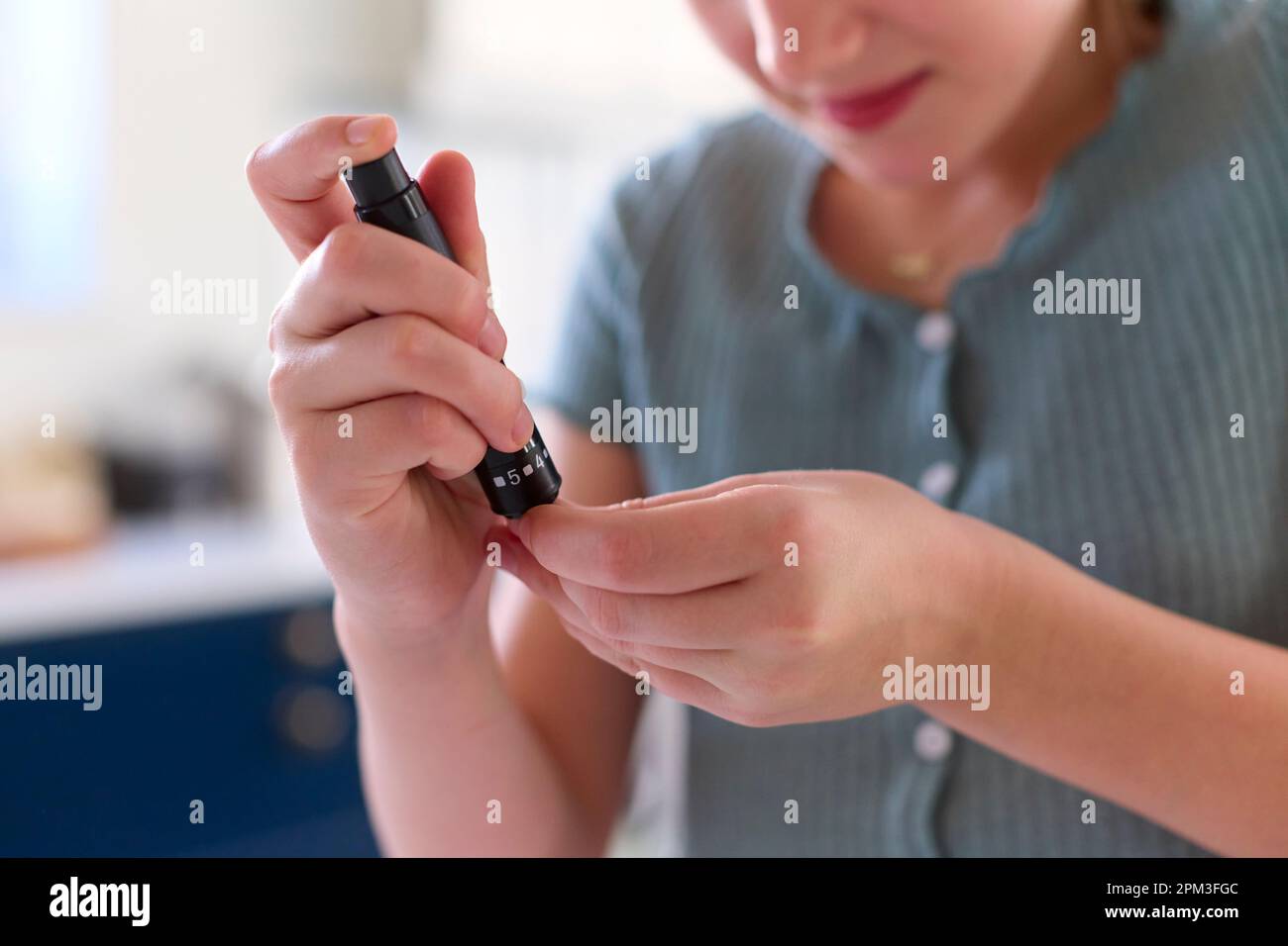 Close Up Of Diabetic Girl At Home Testing For Blood Glucose Level With ...