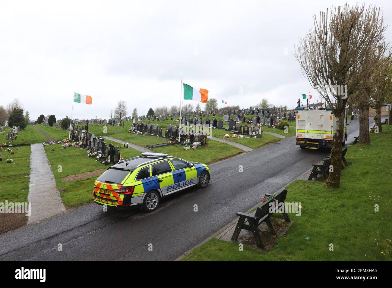 A PSNI vehicle and an Army Technical vehicle at Derry City Cemetery ...