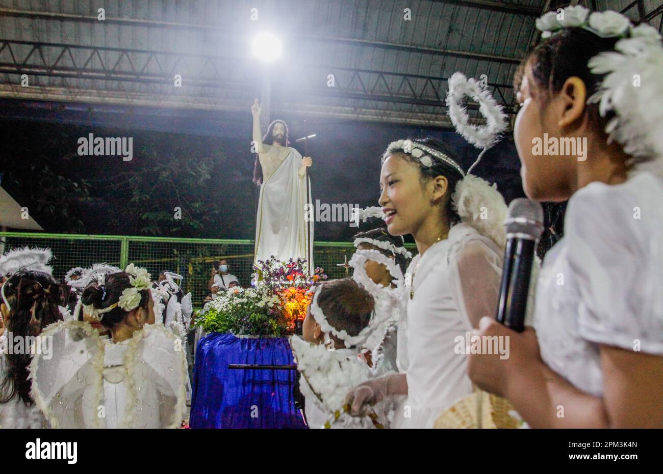 Catholic devotees attend the traditional Salubong followed by Easter Sunday mass at Barangay ...