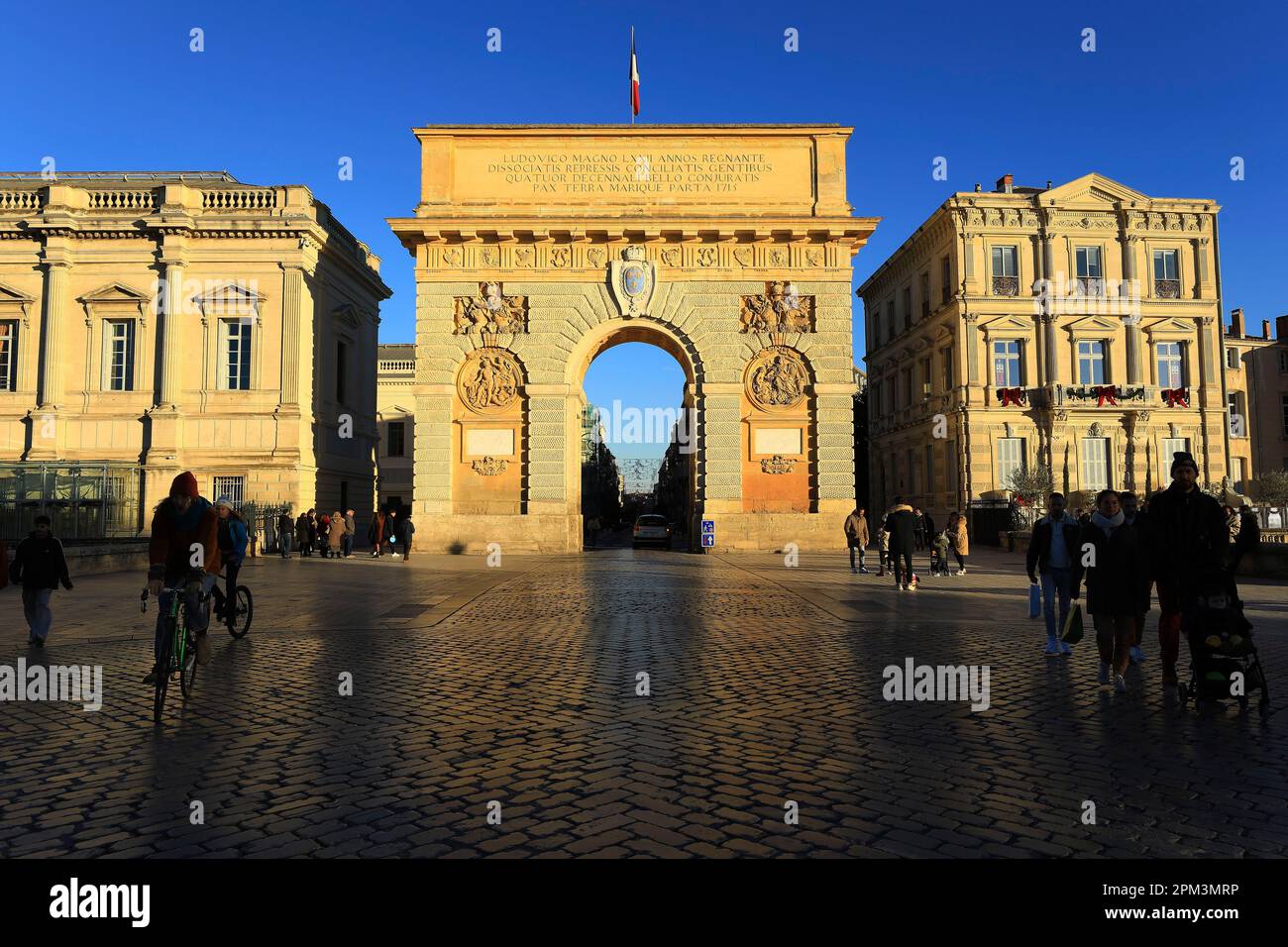 France, Herault, Montpellier, Arc de Triomphe (17th century) and rue ...