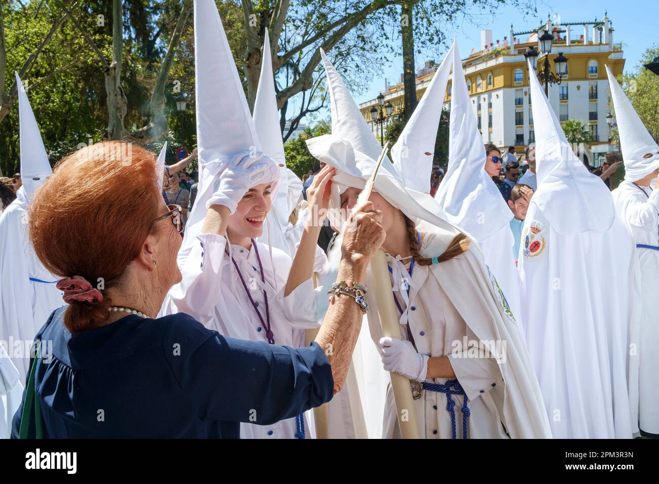 Seville Spain. Holy Week, Semana Santa. Young ladies wearing nazareno ...