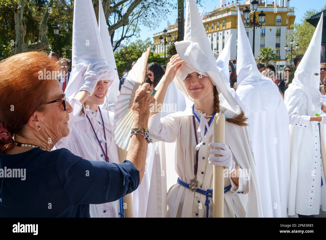 Seville Spain. Holy Week, Semana Santa. Young ladies wearing nazareno ...