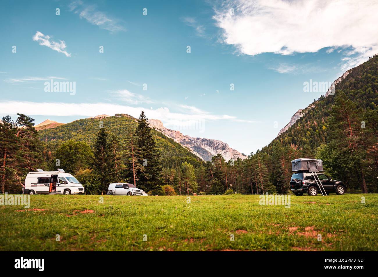 various camper vehicles in a valley with amazing landscape views of ...