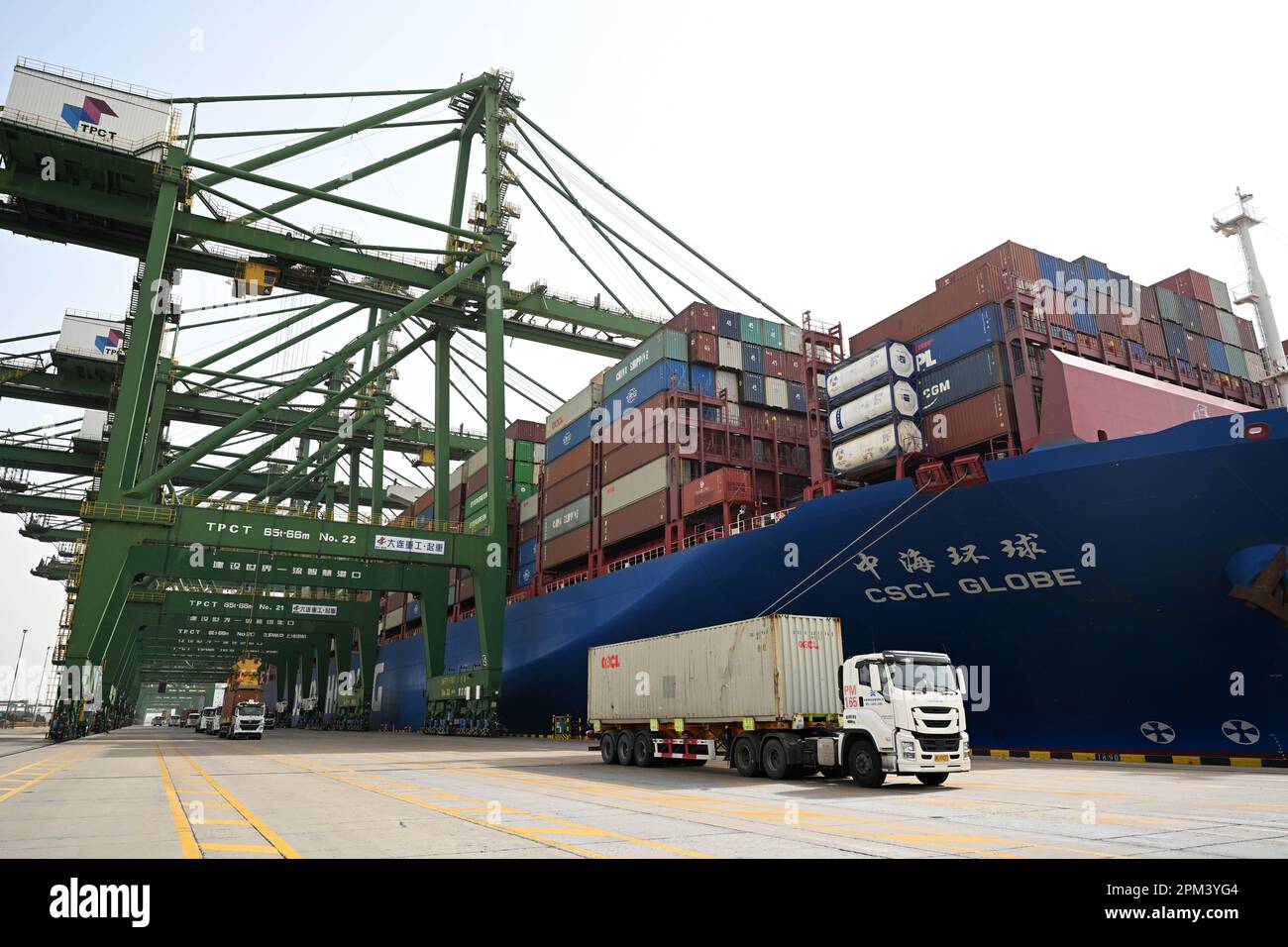 Tianjin. 11th Apr, 2023. Containers are transported by trucks at the ...