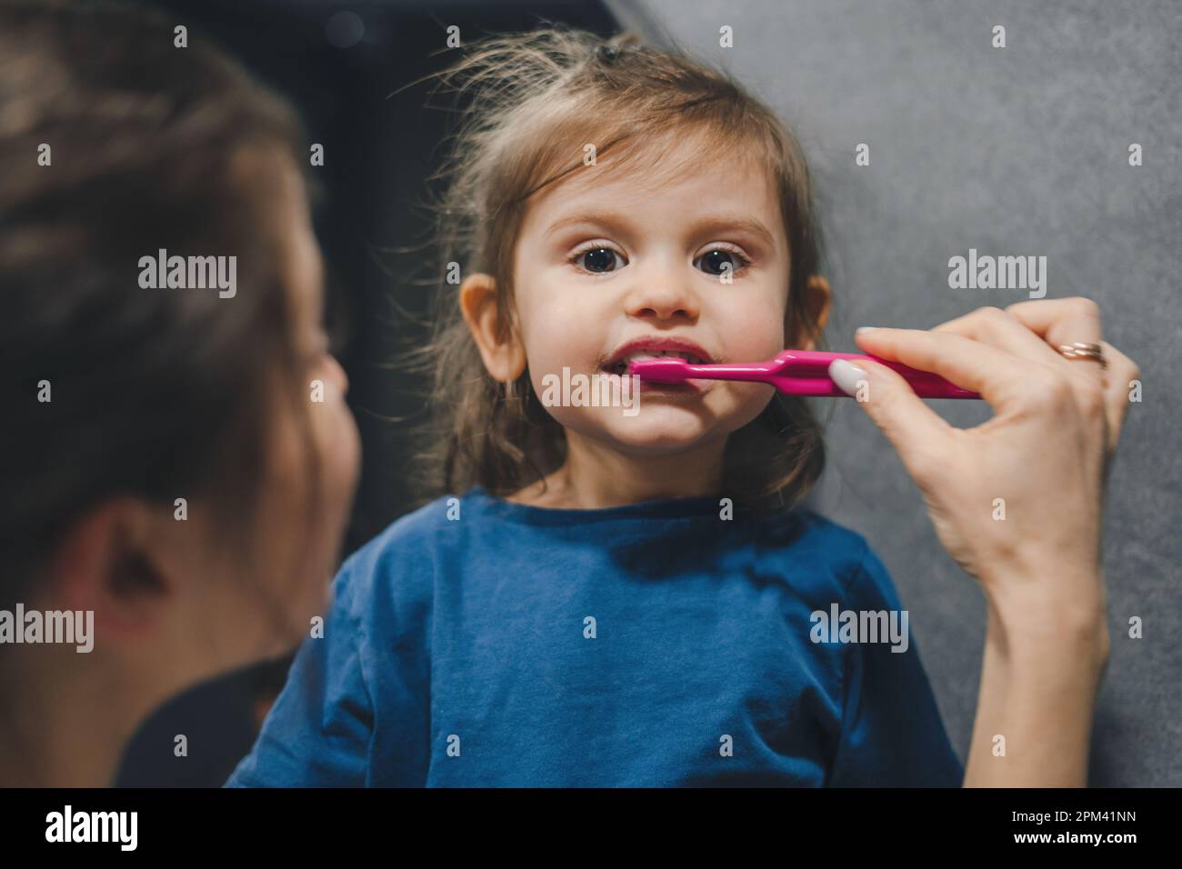 Helping kid brush teeth hi-res stock photography and images - Alamy