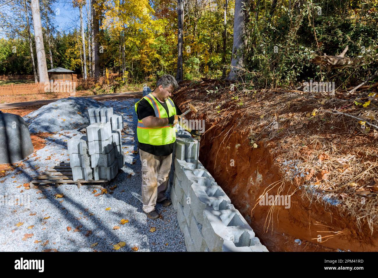 As contractor was installing newly constructed large block retaining ...