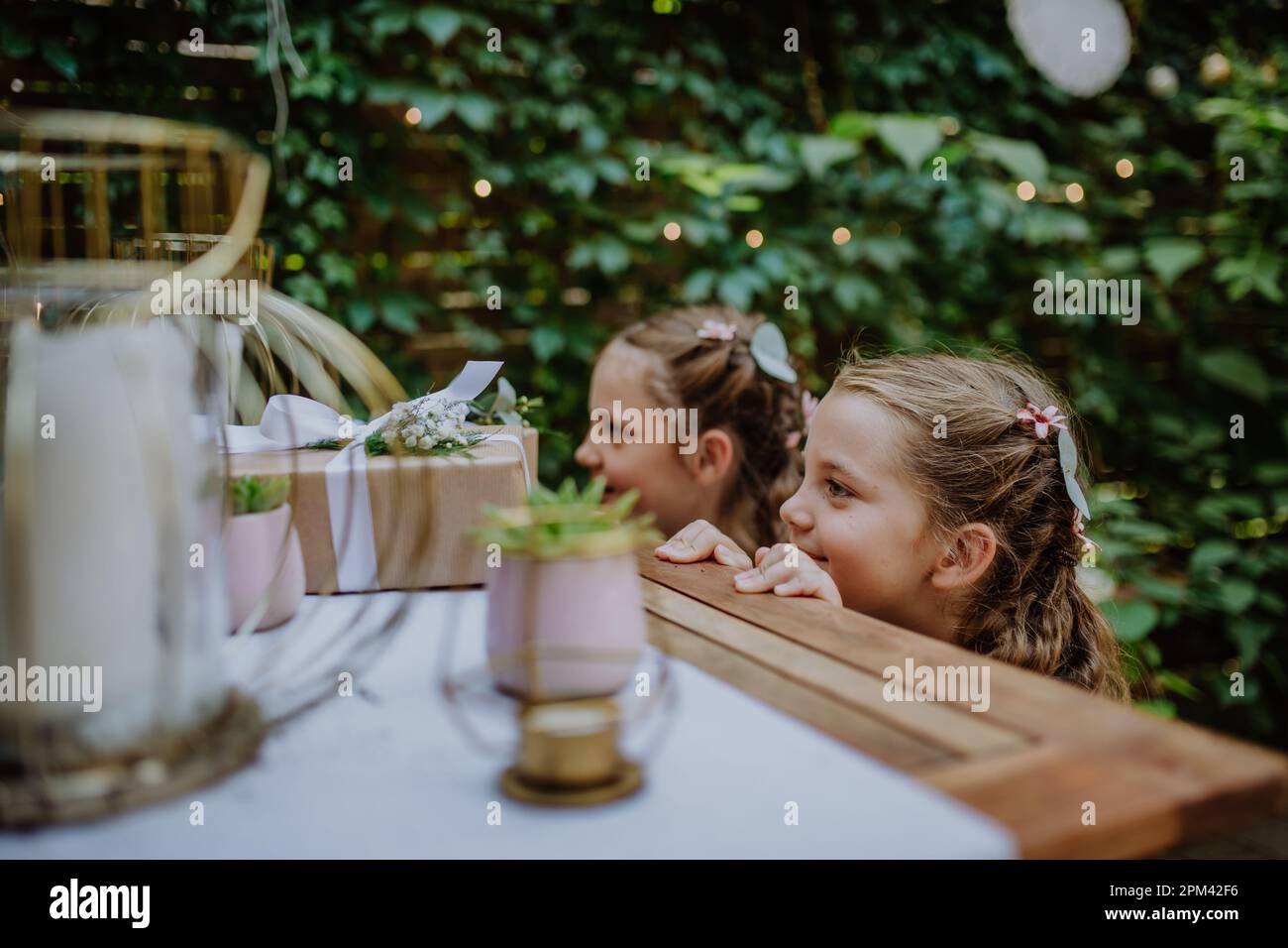 Little girls at outdoor wedding garden party Stock Photo - Alamy