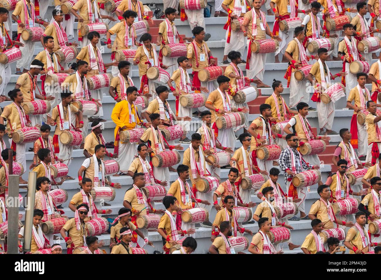Assamese musicians in traditional attire practice playing Dhols or ...