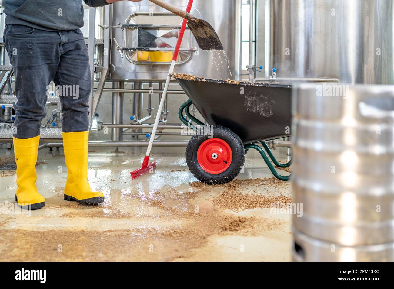cleaning the boiler from residual malt after brewing beer in the ...