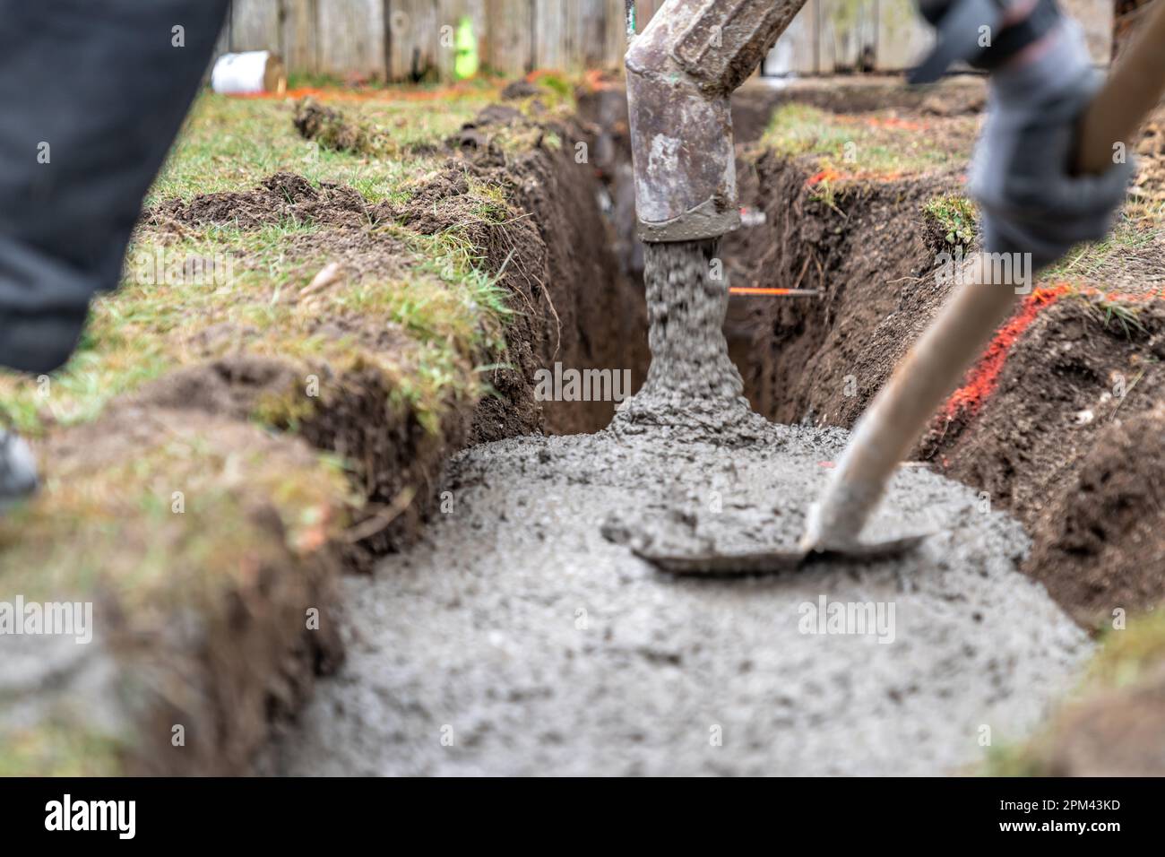 concreting from the pipe of the cement mixing car Stock Photo - Alamy
