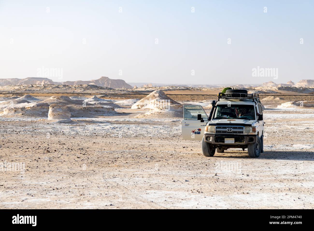 A tour jeep parked in the white desert in Bahariya in Egypt Stock Photo ...