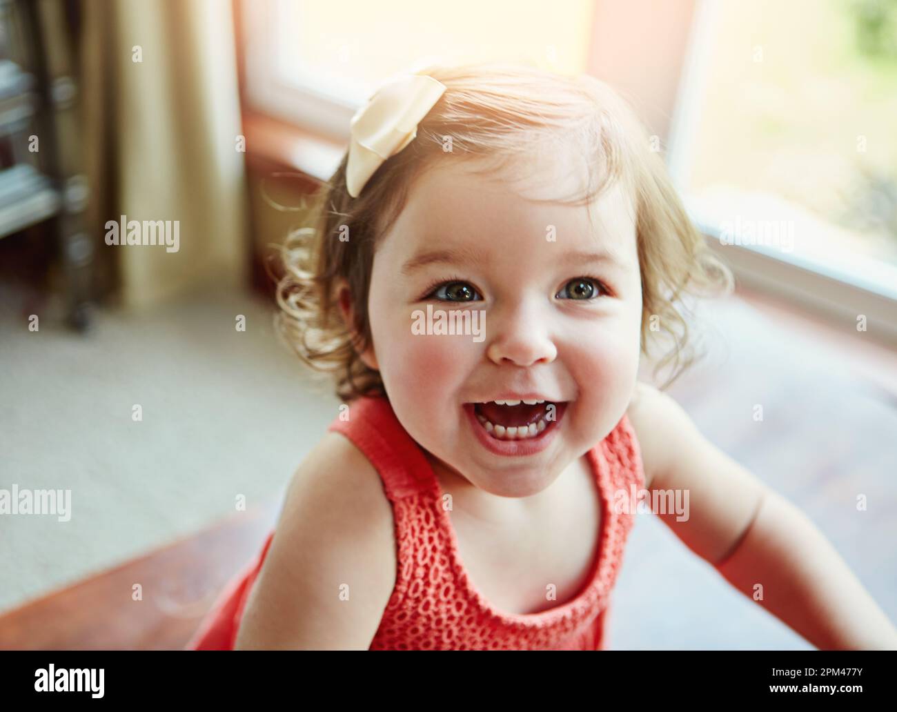 Being young means enjoying days full of fun. an adorable little girl at ...