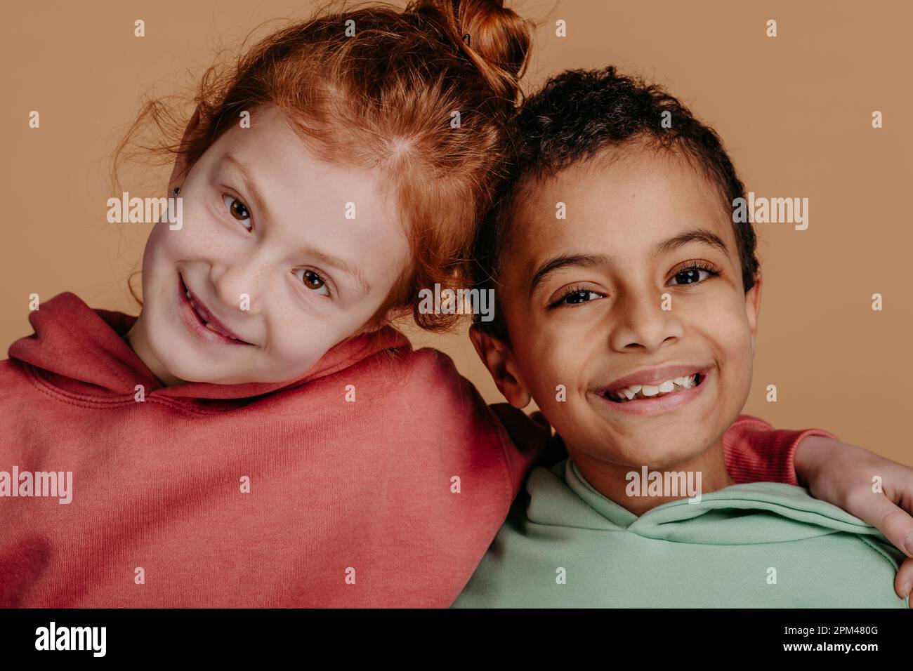 Boy with his friend posing during studio shoot Stock Photo - Alamy