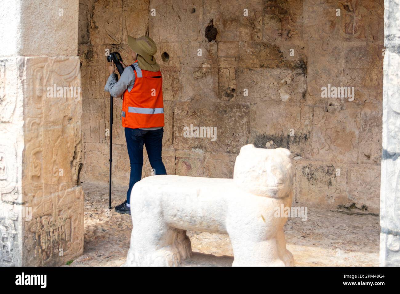 An archaeologist working in one of the ancient Mayan ruins of Chichen ...
