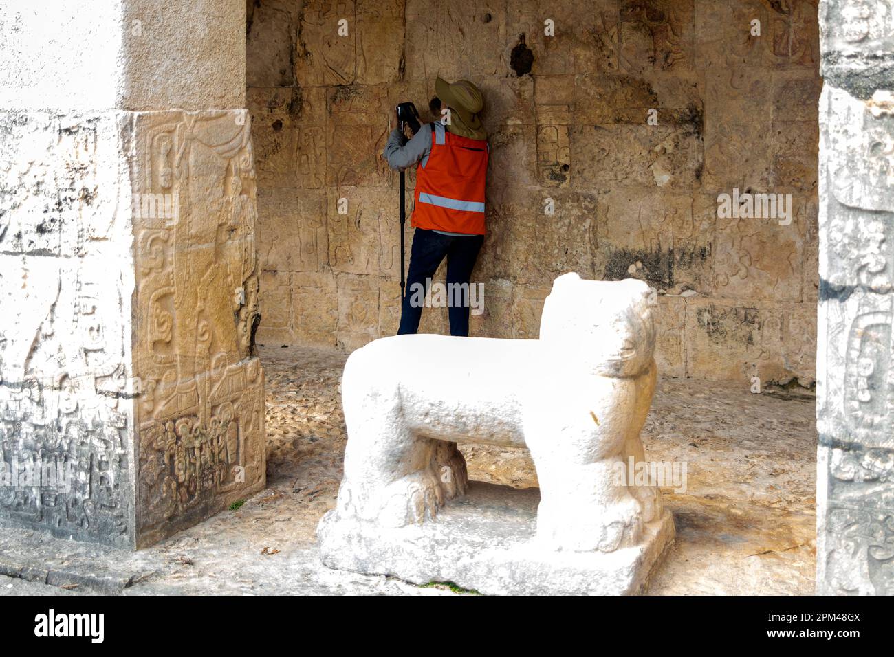 Archaeologist working in one of the ancient Mayan ruins of Chichen Itza ...
