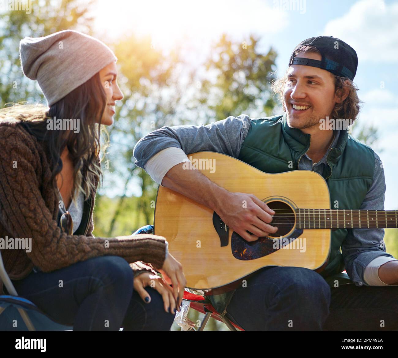 Expressing his love through his music. a young man playing his ...