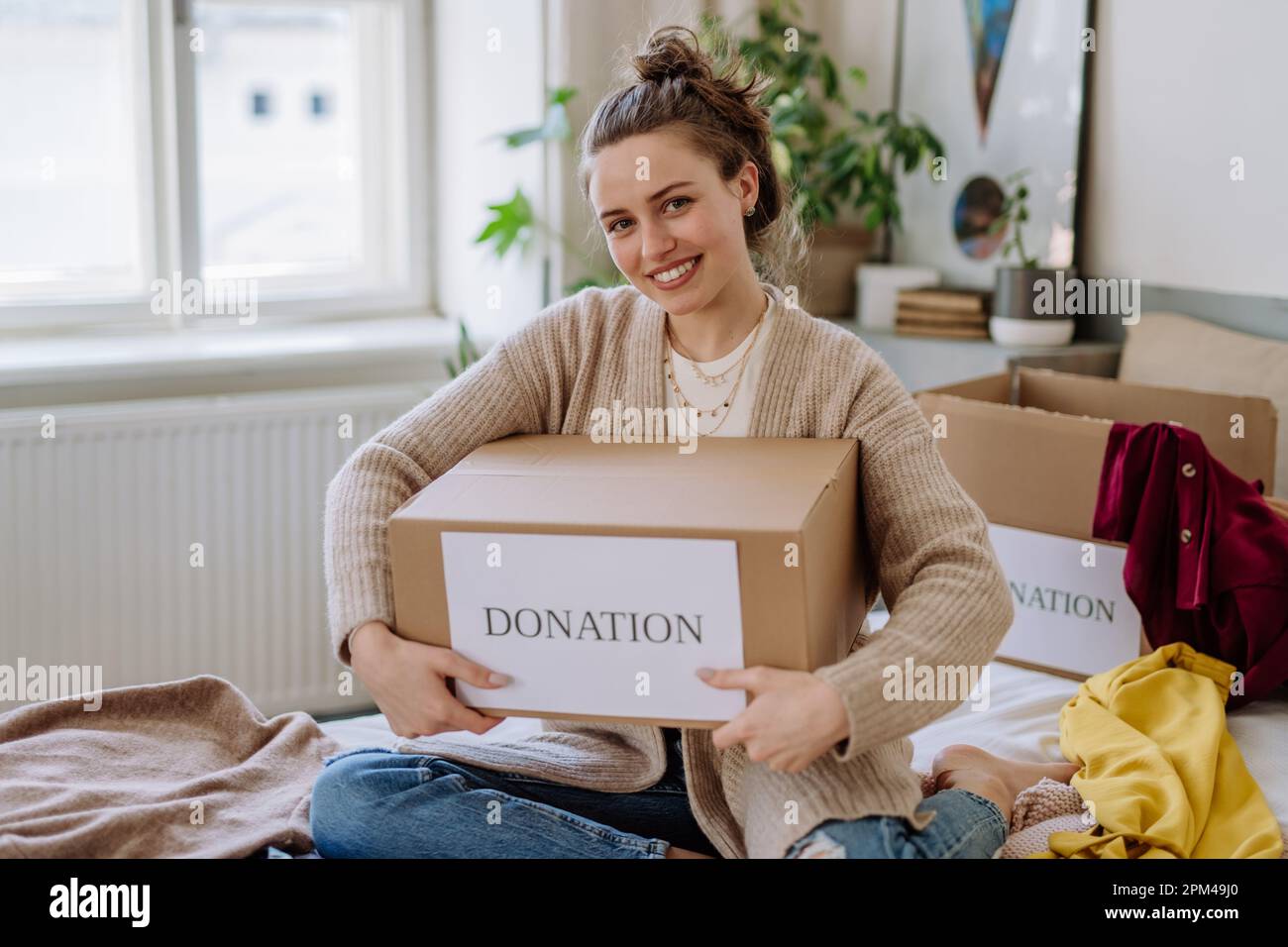Woman organising clothes wardrobe hi-res stock photography and images ...