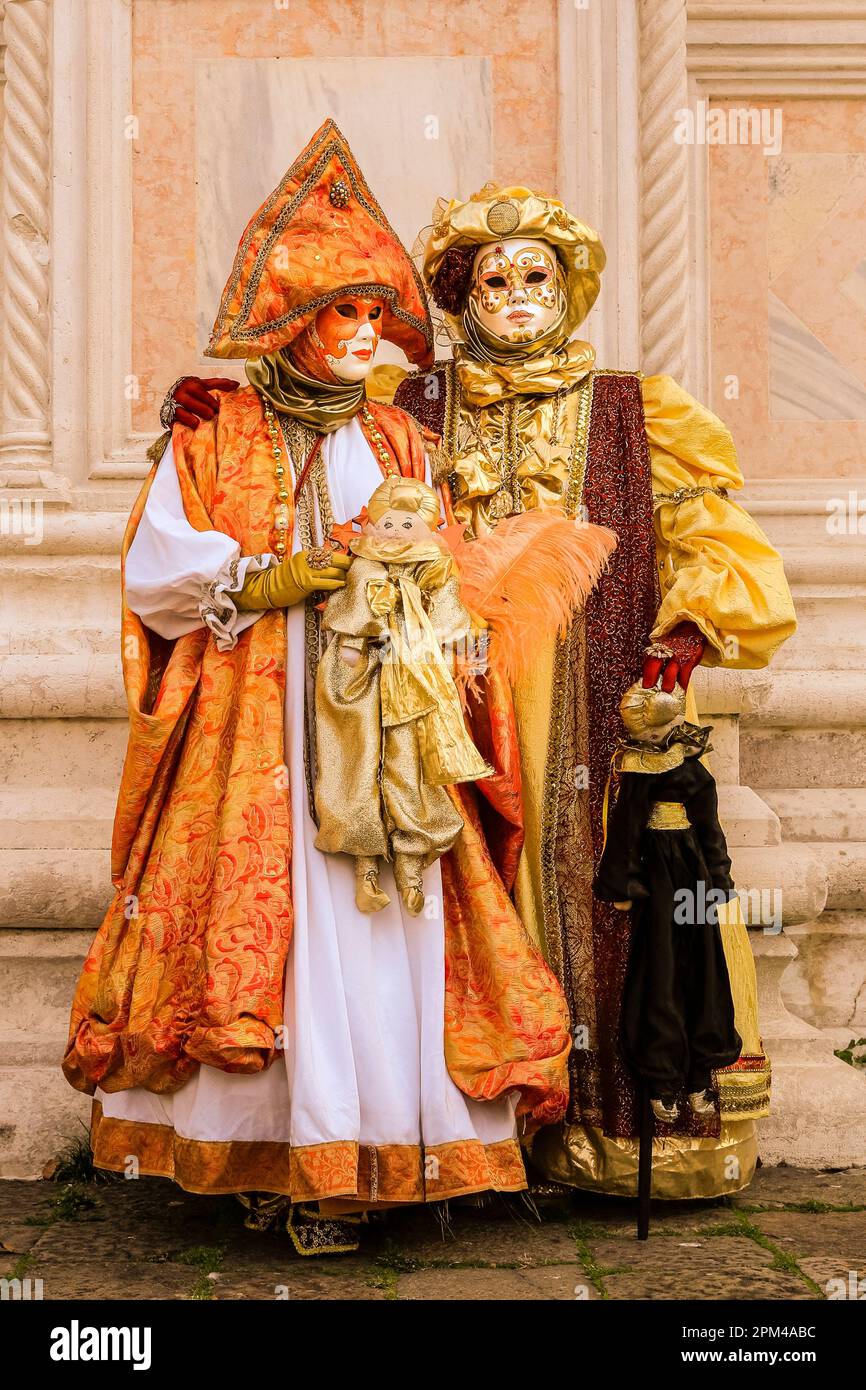 Venice carnival, man and woman in elaborate Venetian historic costumes ...