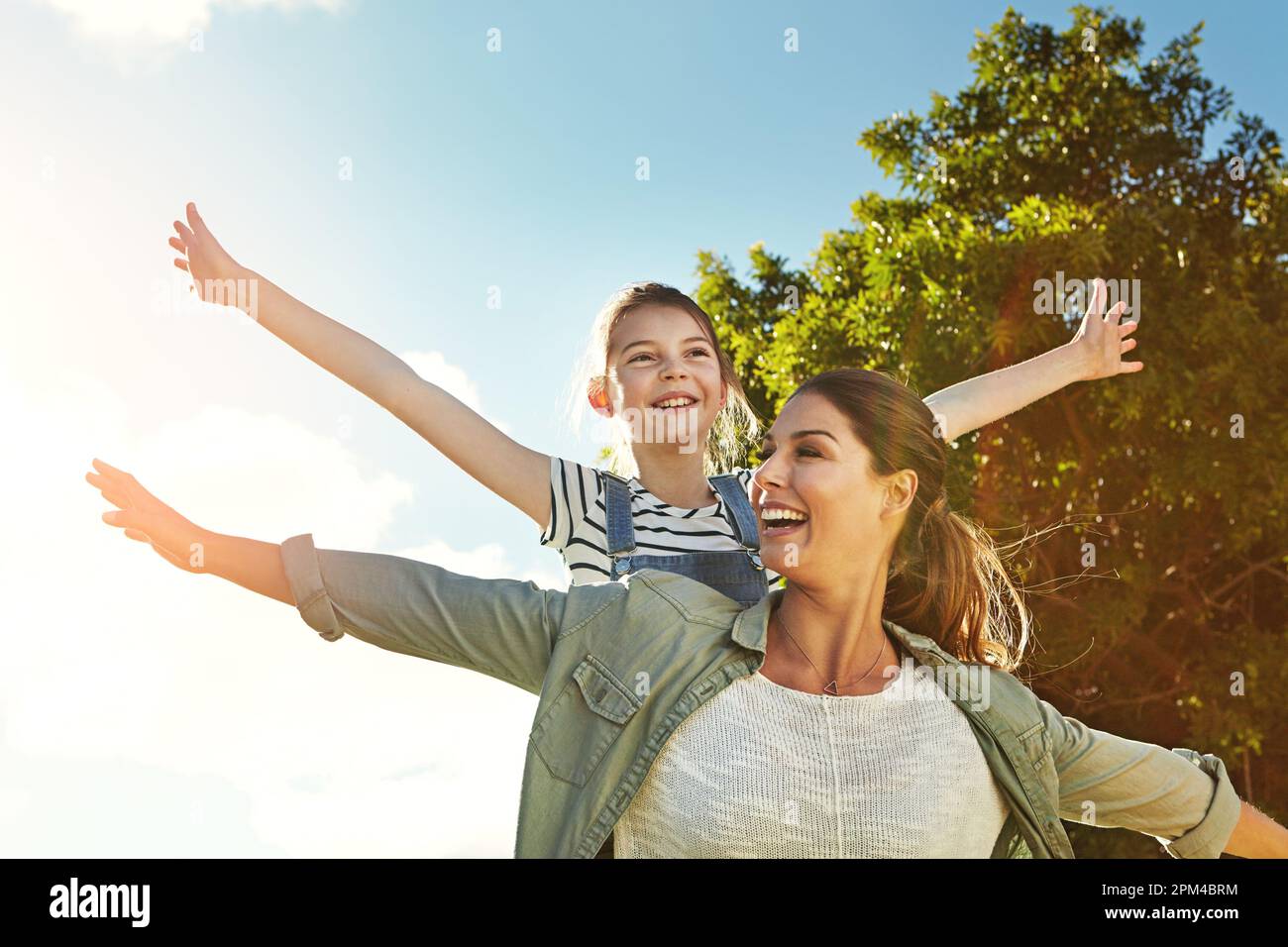 Carefree as can be. a mother and her daughter bonding together outdoors Stock Photo - Alamy