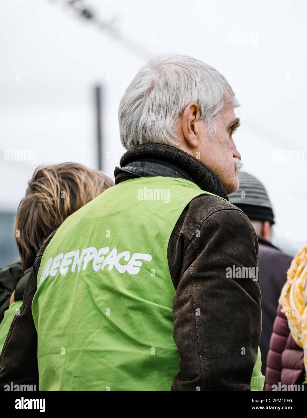 Strasbourg, France - Mar 29, 2023: Mature adults wearing Greenpeace ...